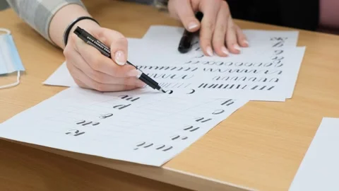 Closeup of a child writing letters in co... | Stock Video | Pond5
