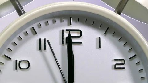 Closeup of clock face as hands reach 12-... | Stock Video | Pond5