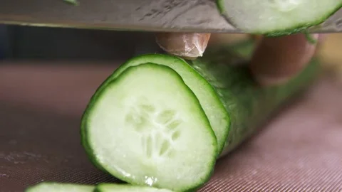 Closeup Cooker Cuts Cucumber with Sharp ... | Stock Video | Pond5