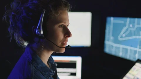 Closeup on female dispatcher focused on ... | Stock Video | Pond5