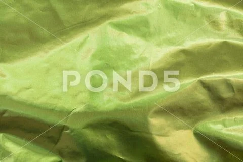 Photograph: Closeup of green wrinkled paper texture background #74982422