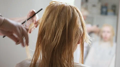 Closeup of hairdresser making haircut to... | Stock Video | Pond5