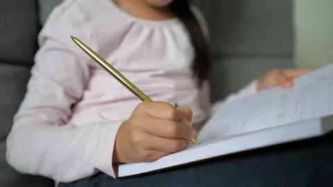 Closeup hand of child write in notebook ... | Stock Video | Pond5