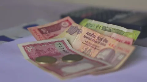 Closeup of Indian rupee coins falling ov... | Stock Video | Pond5