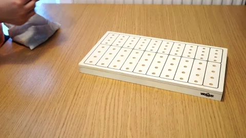 Closeup of Kids playing Mastermind woode... | Stock Video | Pond5