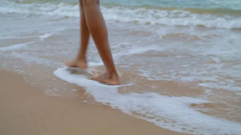 Closeup legs walking ocean beach. Slim w... | Stock Video | Pond5