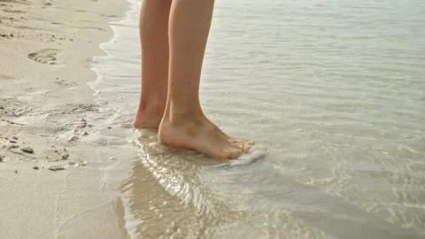 Closeup of little boy checking sea water... | Stock Video | Pond5
