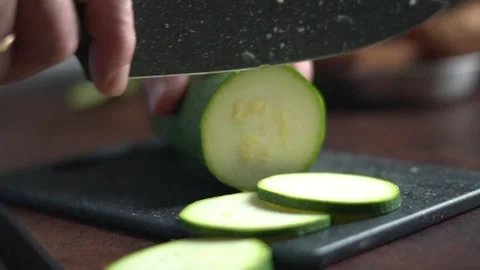 Closeup of male hands cutting courgette ... | Stock Video | Pond5