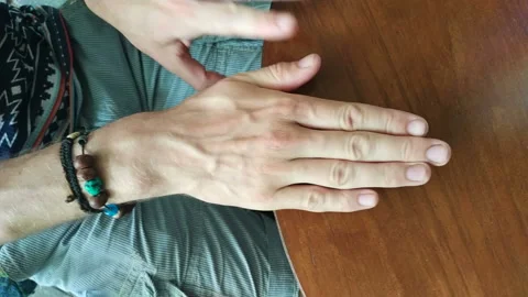 Closeup male hands tapping on the table | Stock Video | Pond5
