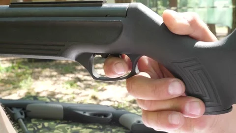 Hand Holding Rifle Stock Video Footage | Royalty Free Hand Holding ...