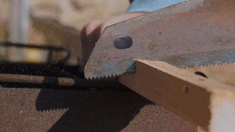 closeup man saws firewood hand saw. male... | Stock Video | Pond5