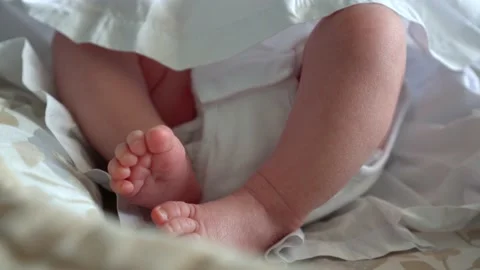 Closeup of a Newborn Baby Feet and Toes | Stock Video | Pond5