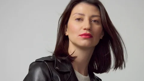 Closeup portrait of 30s woman with blowi... | Stock Video | Pond5