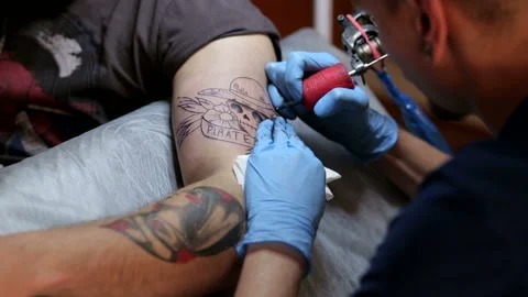 Closeup of process of applying the tatto... | Stock Video | Pond5