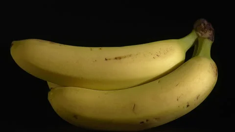 Closeup shot of bananas rotating with a ... | Stock Video | Pond5