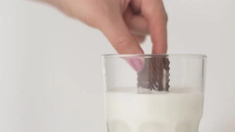 Closeup shot of a female hand dipping do... | Stock Video | Pond5