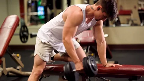 Closeup side view of young bodybuilder d... | Stock Video | Pond5