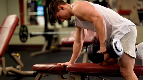 Closeup side view of young bodybuilder d... | Stock Video | Pond5