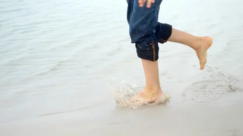 Closeup slow motion of child's feet runn... | Stock Video | Pond5