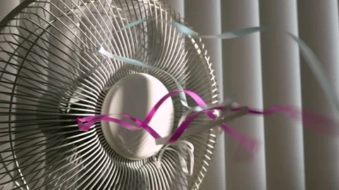 Closeup, static shot of a rotating fan w... | Stock Video | Pond5