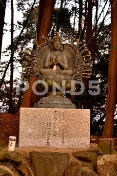Photograph: Closeup of a statue in the forest on the mt. Shosha #125188432