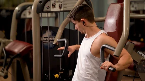 Closeup of teen bodybuilder doing vertic... | Stock Video | Pond5