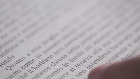 Closeup text in book, woman reading the... | Stock Video | Pond5