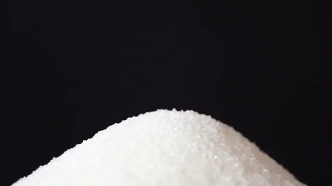 closeup of White sugar cube falling on ... | Stock Video | Pond5