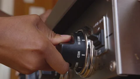 Closeup of Woman Turning an Oven Dial | Stock Video | Pond5