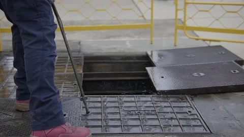 Closing of a single slab street manhole | Stock Video | Pond5