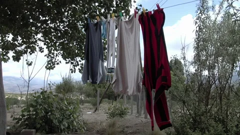 Clothes Drying in the Wind Hanging on a ... | Stock Video | Pond5