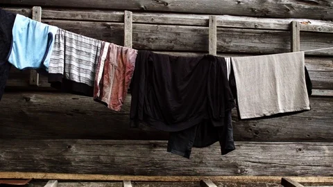 Clothes hanging on a rope on the backgro... | Stock Video | Pond5