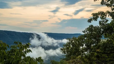 Clouds forming in mountain gorge above a... | Stock Video | Pond5