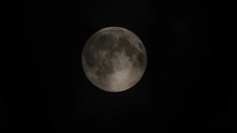 Clouds passing by the full moon, real ti... | Stock Video | Pond5