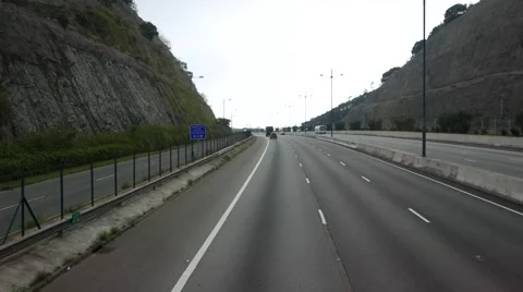 Cloudy highway road pass through cutting... | Stock Video | Pond5