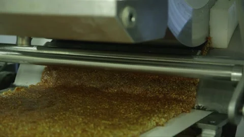 clumped mass of jelly and nuts on a pres... | Stock Video | Pond5