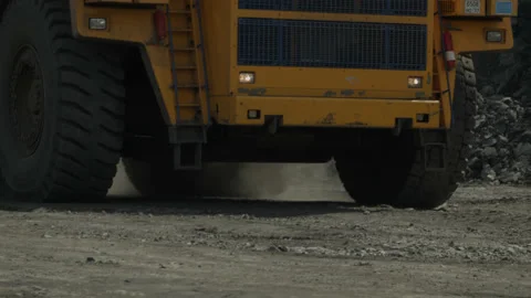 Coal dust raised by the wheels of dump t... | Stock Video | Pond5