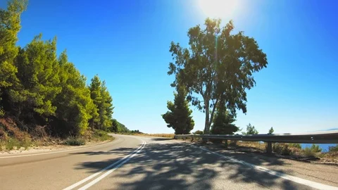 Coast car travel green forest trees clea... | Stock Video | Pond5