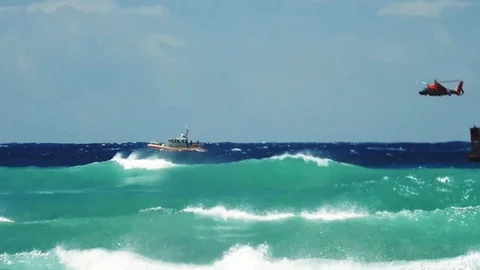 Coast Guard Boat and Chopper in Choppy S... | Stock Video | Pond5