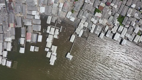 Coastal Slums with Contaminated Water in... | Stock Video | Pond5