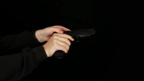 Cocking A Gun Stock Footage ~ Royalty Free Stock Videos | Pond5