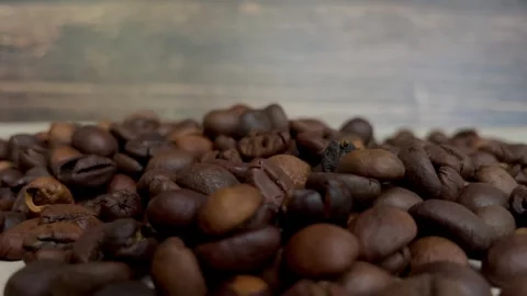 coffee beans fall on the table | Stock Video | Pond5