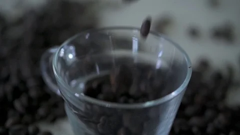 Coffee Beans Falling Into Cup Spilling O... | Stock Video | Pond5