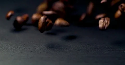 Coffee Beans Falling Towards the Camera | Stock Video | Pond5