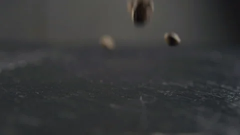 Coffee beans thrown against black backgr... | Stock Video | Pond5