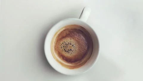 Coffee brewing in cup motion background | Stock Video | Pond5