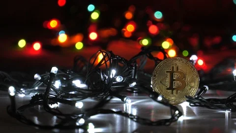 Coin of bitcoin.Christmas tree lights in... | Stock Video | Pond5