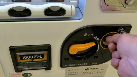 A coin inserted inside the vending machi... | Stock Video | Pond5