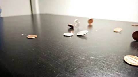 Coins Dropping Onto A Table Slow Motion. | Stock Video | Pond5