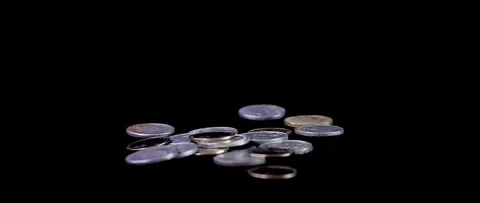 Coins falling one by one on a black back... | Stock Video | Pond5